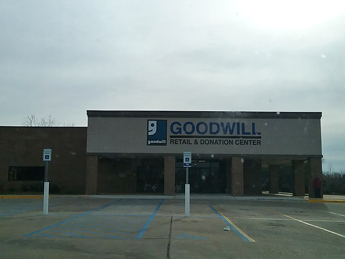 Dawn or dusk, the Goodwill's welcoming facade stands ready for treasure seekers. The parking spots might be empty now, but they'll soon fill with hopeful hunters.