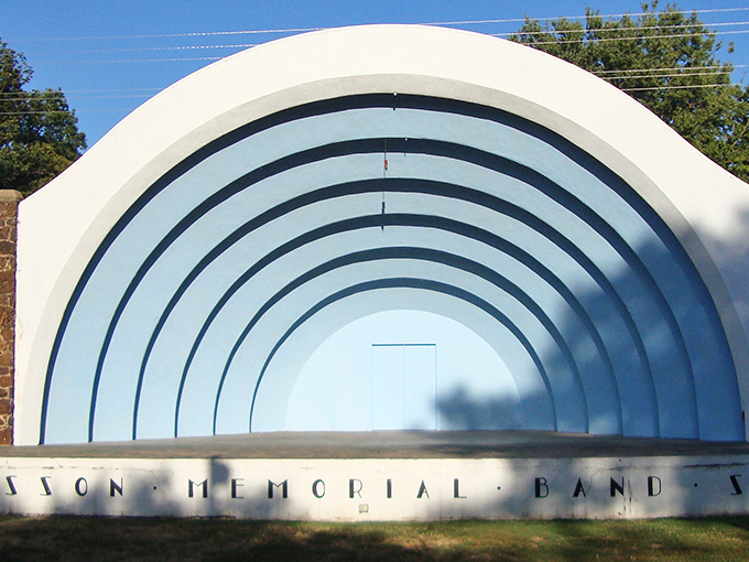 The Swensson Memorial Band Shell stands like a mid-century modern dream, ready to fill summer evenings with music that makes the prairie come alive.