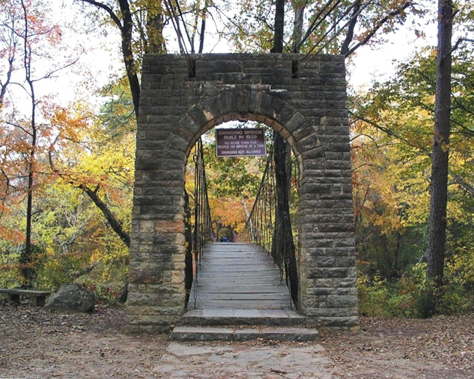 Fall's golden palette transforms the swinging bridge into a scene straight out of a storybook. Walking across feels like stepping into an autumn painting.