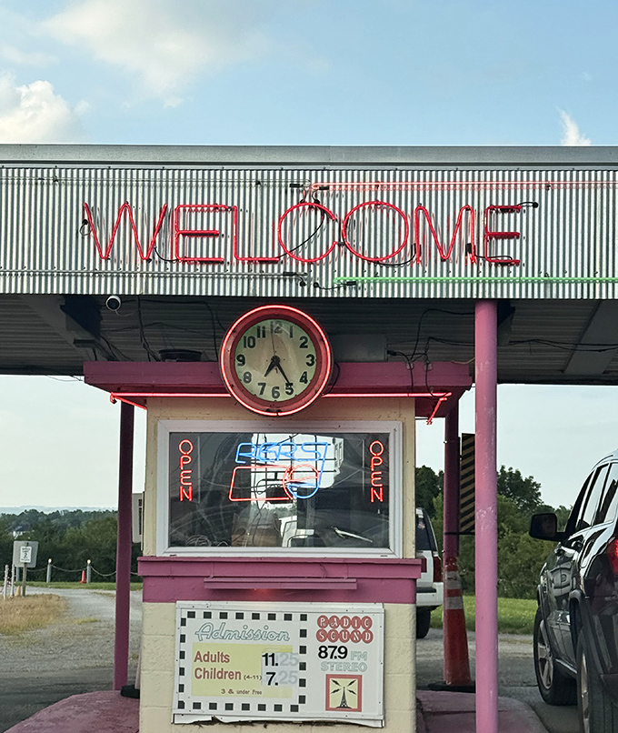 The neon "WELCOME" sign glows like a beacon from another era, complete with vintage clock and ticket prices that feel like a bargain.