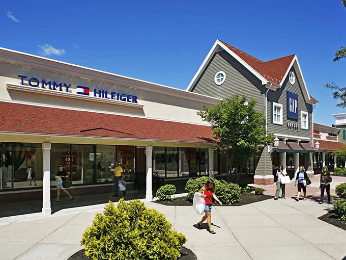 Tommy Hilfiger and GAP stand shoulder to shoulder like old friends, welcoming bargain hunters with promises of nautical stripes and everyday basics.