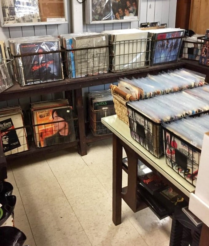 Vinyl records organized like a music lover's fever dream, where Sinatra might sit next to Springsteen.