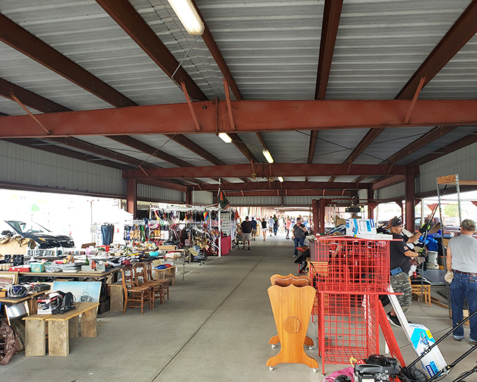 Under the open-air pavilion, weekend warriors hunt for bargains while vendors arrange their wares, creating a marketplace that's part bazaar, part community gathering.