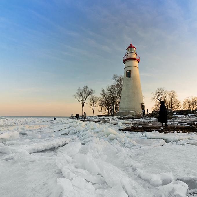 Winter transforms Marblehead into an Arctic wonderland, where ice sculptures created by nature frame the steadfast sentinel of Lake Erie.