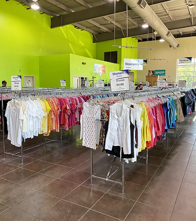 A rainbow of possibilities hangs in perfect order. Like a fashionista's dream where every garment has a story and every price tag brings joy.