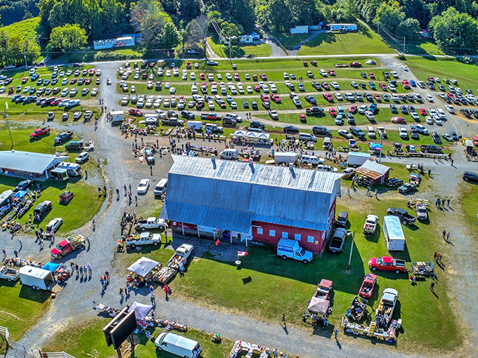 From above, it resembles a small city of commerce, with the iconic red barn standing sentinel over a sea of vendors and bargain-seekers.
