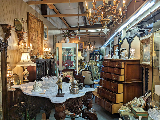 Step into this antique booth where elegant chandeliers illuminate treasures that whisper stories from bygone eras.