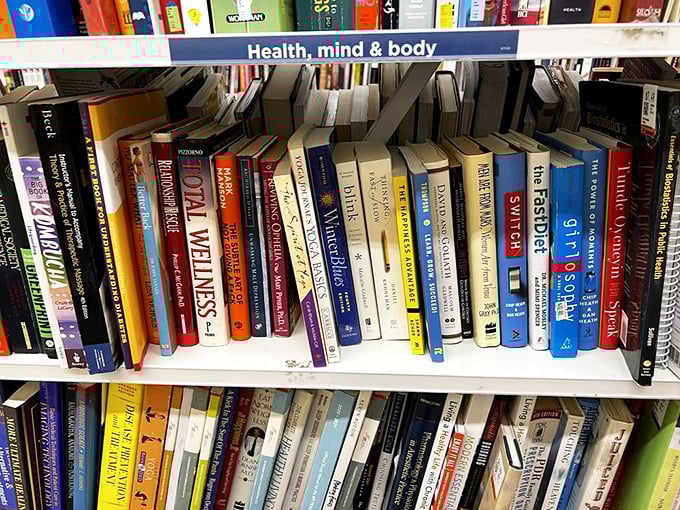 Self-help meets self-discovery in these packed shelves. One person's discarded "Total Wellness" might become your new life philosophy.