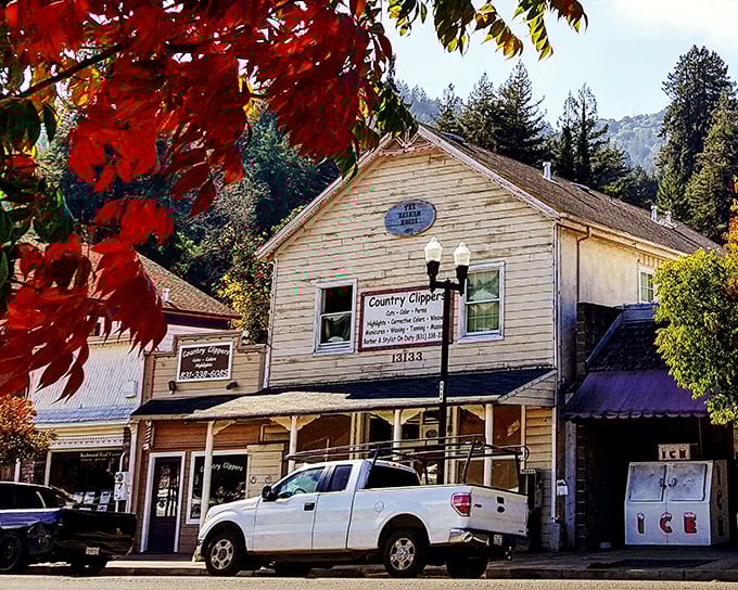 Country Clipper stands framed by autumn's fiery display. In Boulder Creek, even haircut appointments come with a side of seasonal splendor.