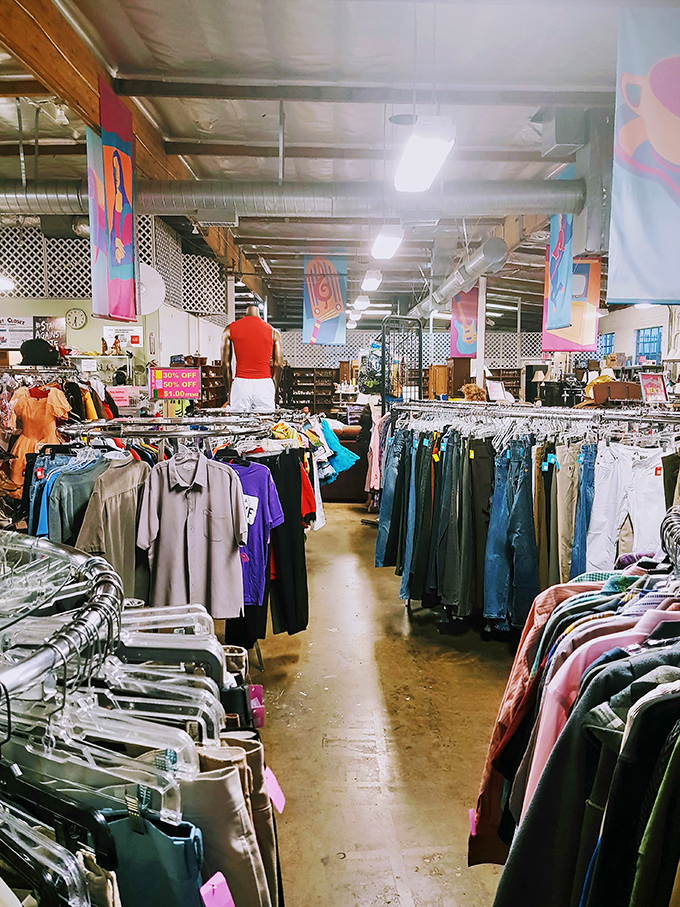 Rows upon rows of carefully organized clothing create a rainbow road of fashion possibilities where yesterday's trends await their second act.