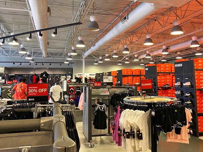 The Nike outlet's impressive wall of orange shoeboxes&mdash;like a monument to fitness aspirations and weekend warrior dreams.