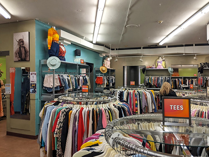 Circular racks create a textile rainbow of possibilities, where yesterday's fashion finds new life and tomorrow's outfit waits to be discovered.