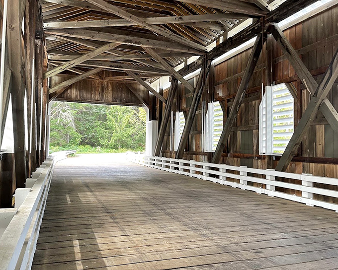 Inside this wooden cathedral, shadows dance with sunlight through louvered windows, creating a mesmerizing light show that no smartphone filter can replicate.