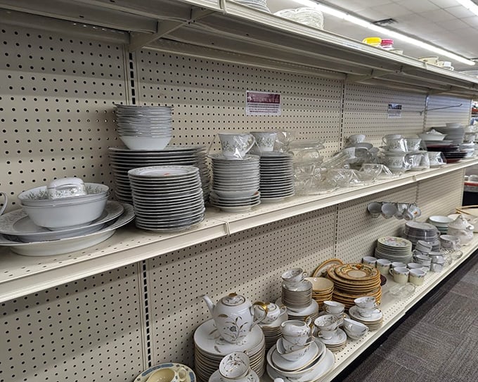 Perfectly stacked white dinnerware awaits new homes &ndash; one person's castoff becomes another's complete dinner service for that long-planned family gathering.