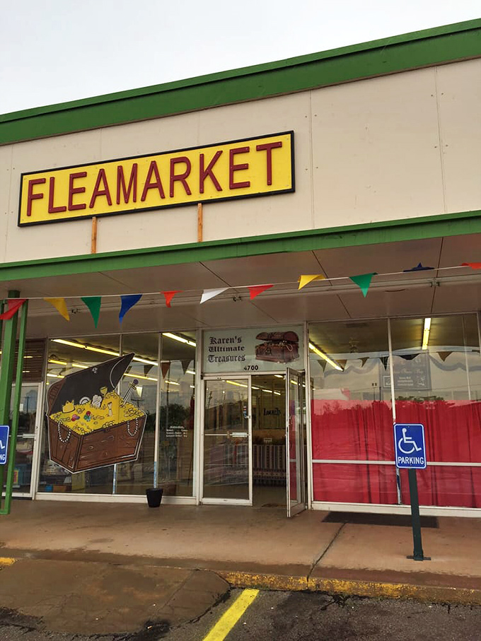 Colorful pennant flags flutter above the entrance, while the painted treasure chest logo promises adventures in bargain hunting that await inside.