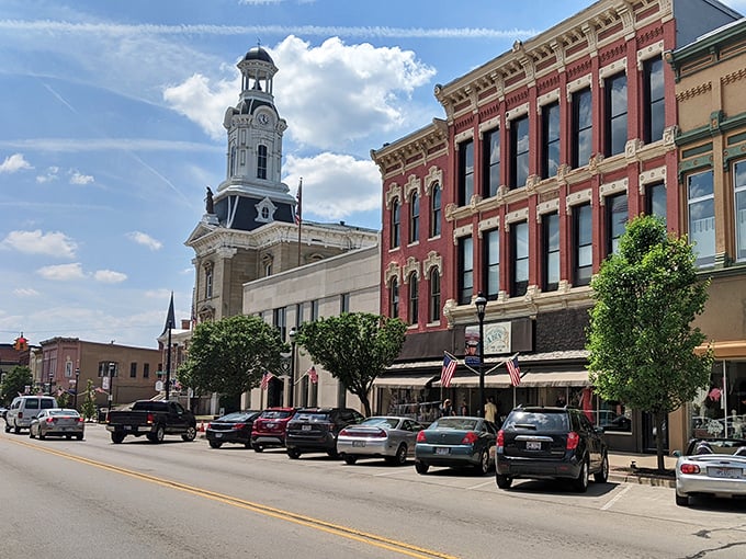 The clock tower rises majestically above brick buildings that have witnessed generations of Greenville stories—some tall, all authentic.