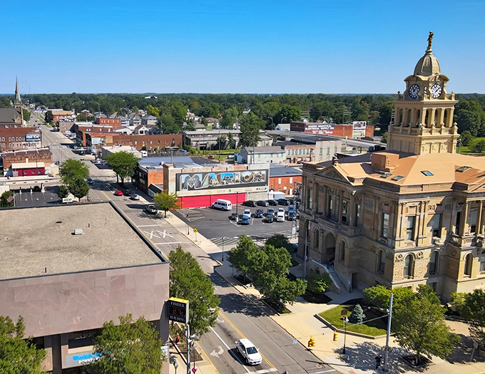 From this bird's-eye view, Marion unfolds like a storybook town, with its orderly grid of streets radiating from the golden-domed courthouse.