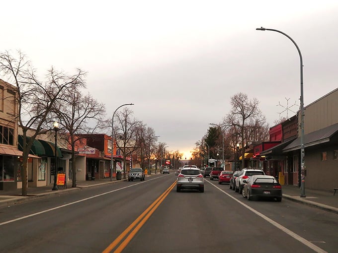 This quiet street scene captures Clarkston's essence – unpretentious, straightforward, and framed by hills that change colors with the seasons like nature's mood ring.