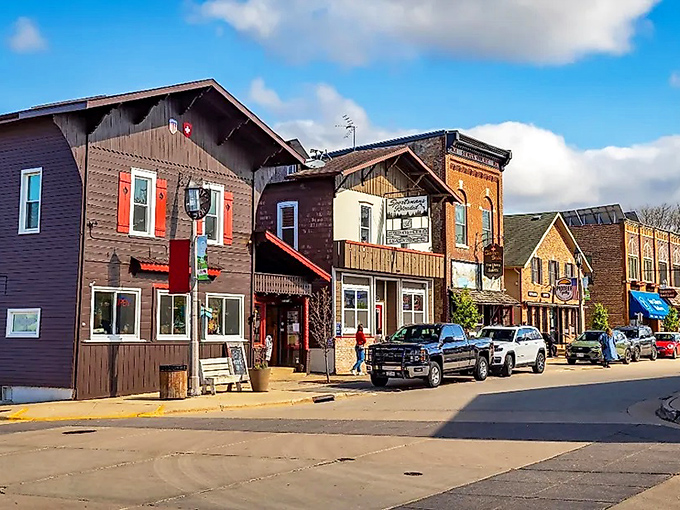Chalet-style buildings line the streets, their wooden facades and bright shutters creating a streetscape that would make actual Swiss villages nod in approval.