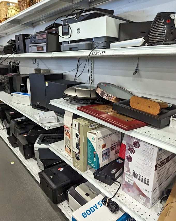 Technology graveyard or innovation museum? These shelves hold yesterday's must-haves waiting for their second act in someone's home office.
