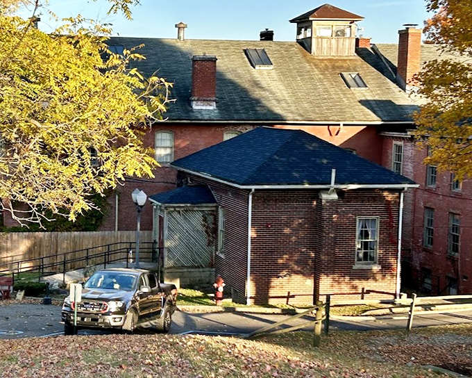 The building's imposing rear view reveals architectural details that whisper of both grandeur and institutional efficiency—a beautiful monster basking in Ohio sunshine.