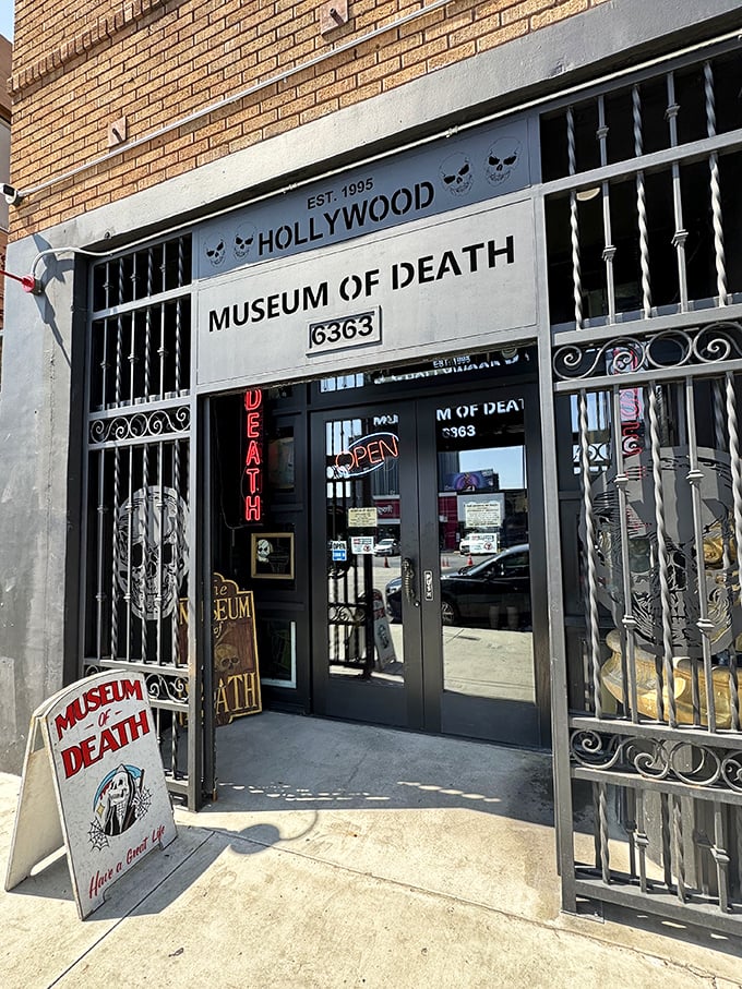 The entrance features ornate wrought iron gates with skeletal designs—your first warning about what awaits inside.