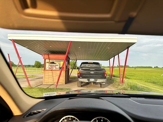 The entrance booth stands like a time portal with its distinctive red beams. "Admission for one trip to yesteryear, please."