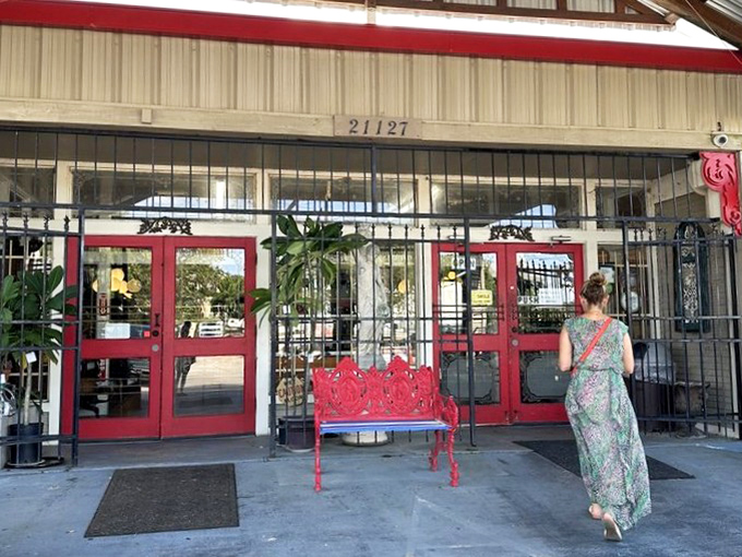 Those red benches have probably supported more excited shoppers catching their breath than a marathon finish line.