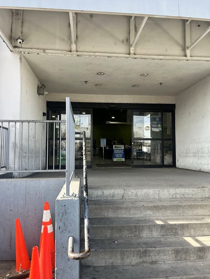 The entrance might not scream "retail therapy," but those in the know recognize this concrete threshold as the gateway to thrifting nirvana.