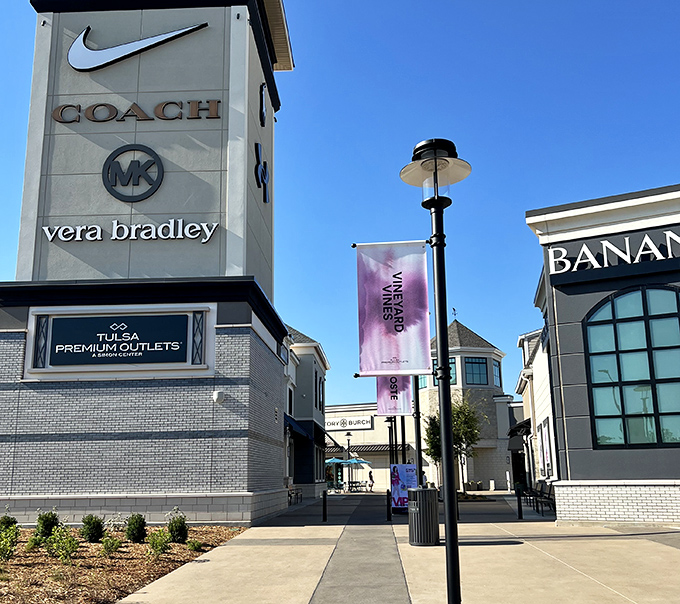 The architectural equivalent of a well-organized closet—clean lines, elegant signage, and premium brands like Coach and Vera Bradley all within easy reach.