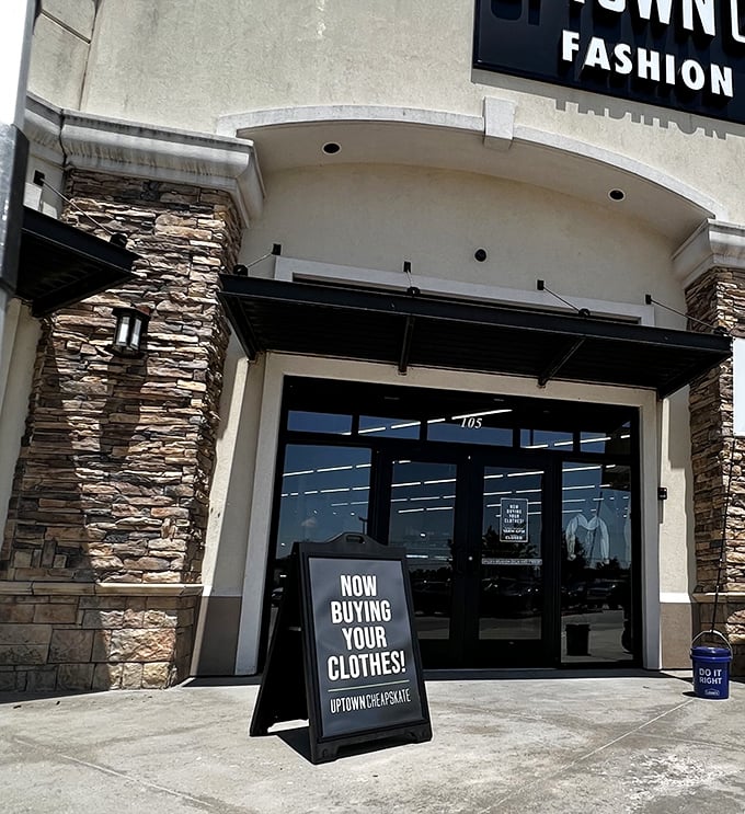 "Now Buying Your Clothes!" The entrance beckons with stone accents and clean lines&mdash;far from the cluttered thrift stores of yesteryear.