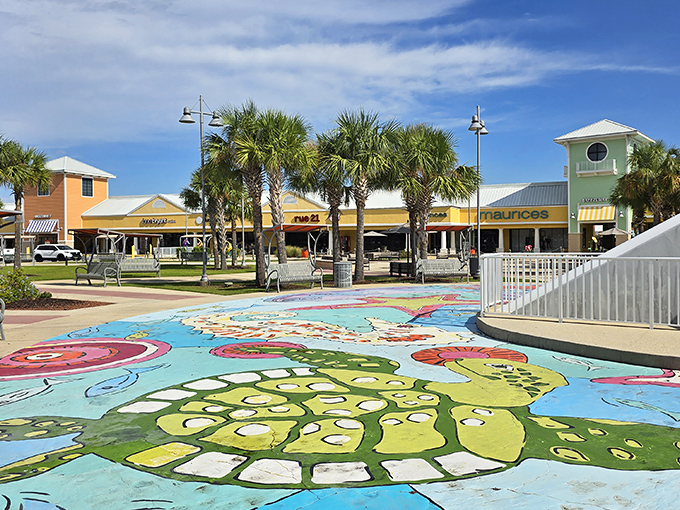 Palm trees stand sentinel over a colorful splash pad, offering respite for weary shoppers and entertainment for kids who've reached their shopping tolerance threshold.
