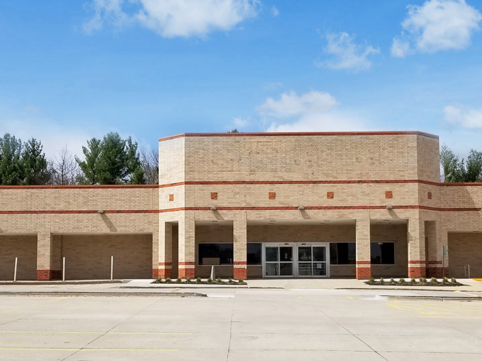 Blue skies frame this thrifter's paradise, where the donation area bustles with activity—one person's castoffs becoming another's newfound treasures.
