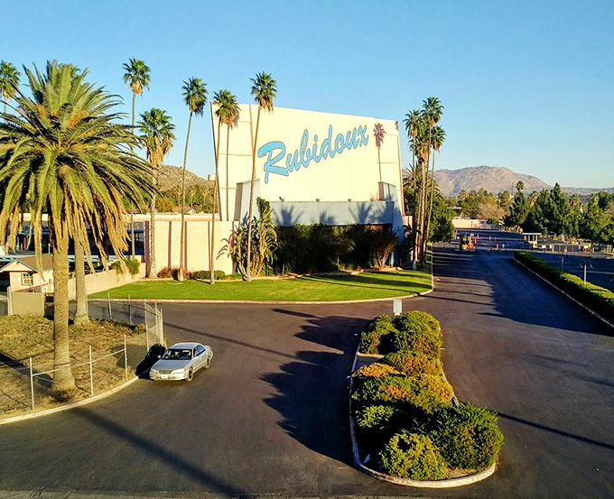 That retro blue script against white concrete announces you've arrived somewhere special&mdash;a slice of Americana preserved in palm-lined perfection.