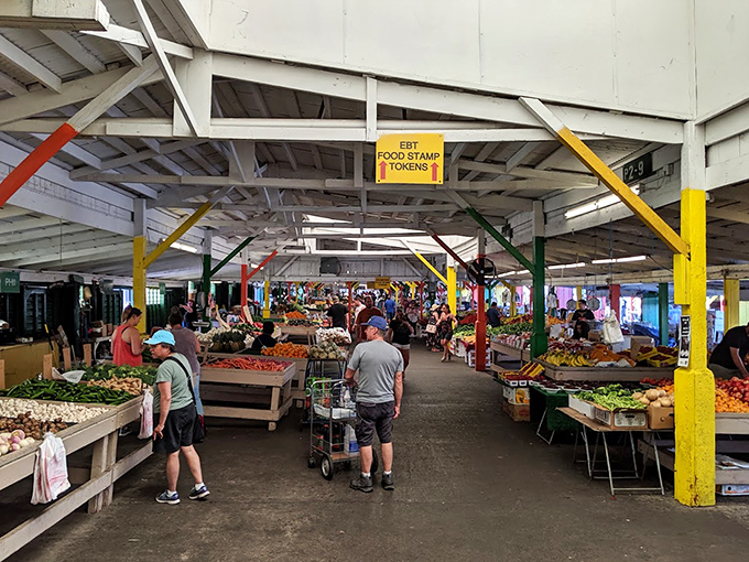 Produce paradise under colorful support beams—where shopping carts replace treasure maps and the bounty is always fresh. Weekend warriors unite!