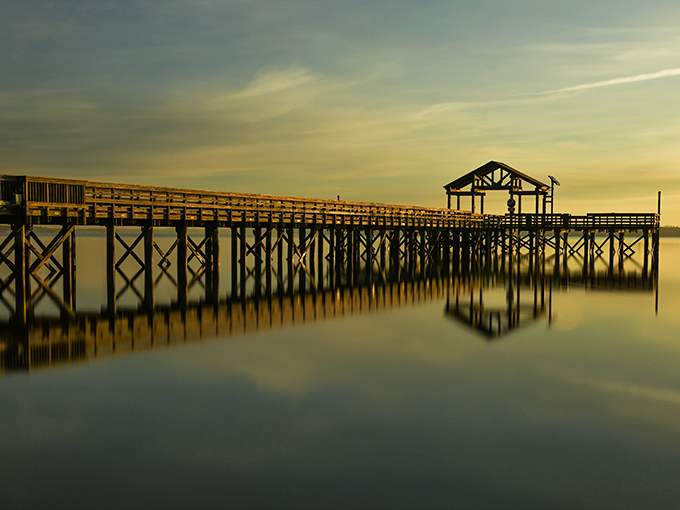 Nature's light show at dusk transforms the ordinary fishing pier into something magical &ndash; proof that Mother Nature remains the ultimate Instagram influencer.