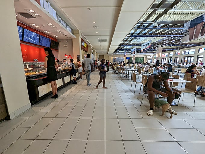 The food court offers a welcome respite between bargain battles, where shoppers refuel before diving back into the retail fray.