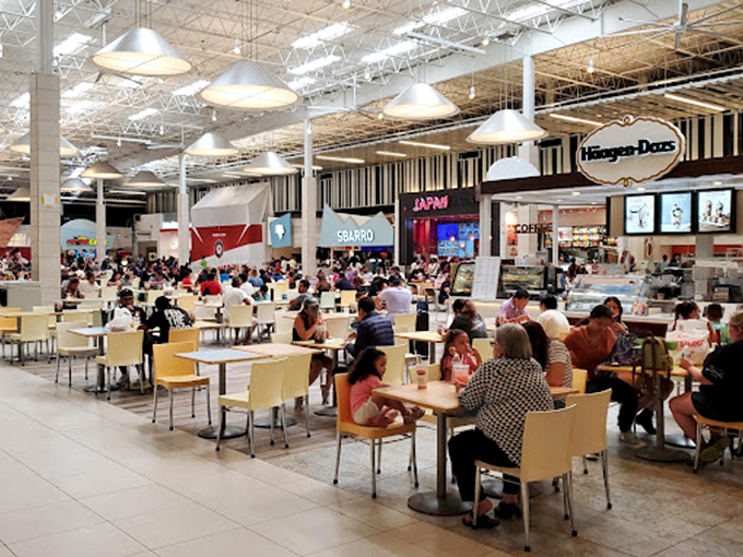 The bustling food court offers a moment of respite for weary shoppers, where international cuisines compete for attention and tired feet find temporary sanctuary.