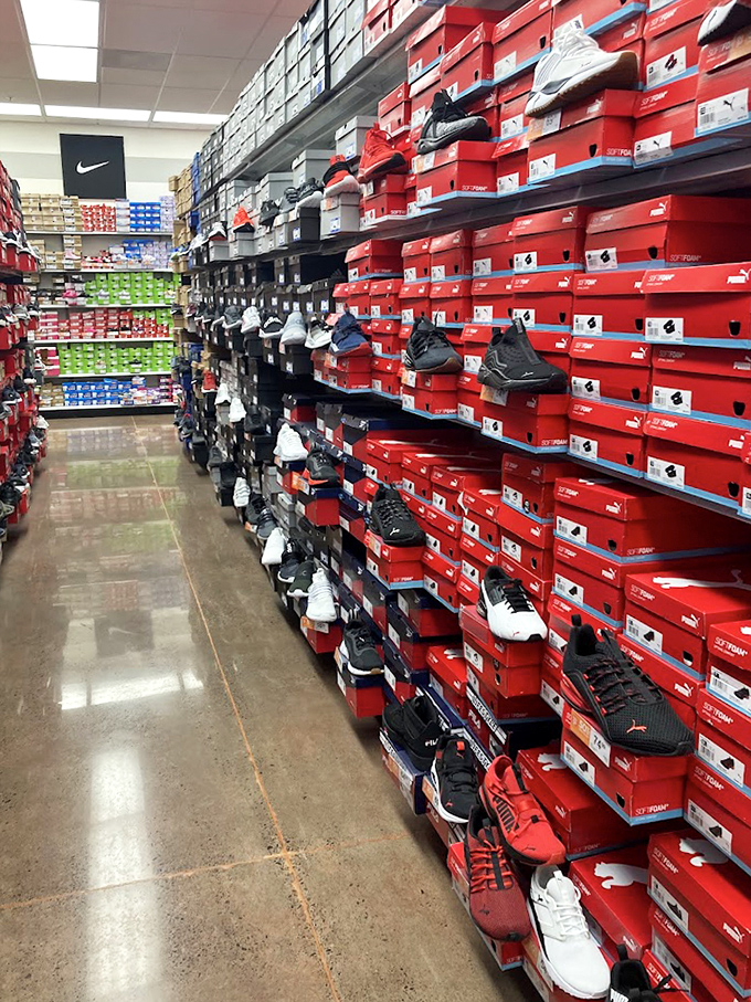 Sneakerhead heaven at the Nike outlet, where walls of red boxes promise athletic performance and street cred in equal measure.