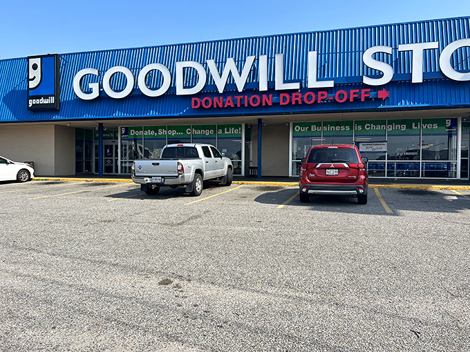 "Donate, Shop... Change a Life!" The storefront's message reminds visitors that every purchase supports job training programs in the community.