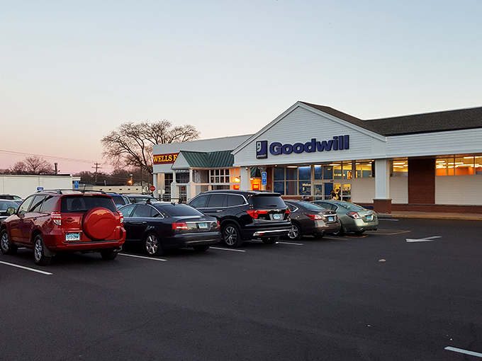 As dusk settles, the Goodwill parking lot fills with cars whose trunks will soon be filled with unexpected treasures and "I can't believe I found this" stories.