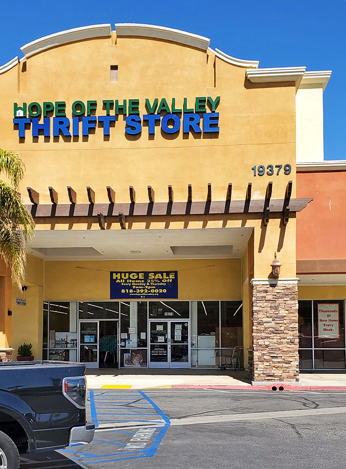 Address proudly displayed, this isn't just a store&mdash;it's a destination. The "HUGE SALE" banner might as well read "ADVENTURE INSIDE."