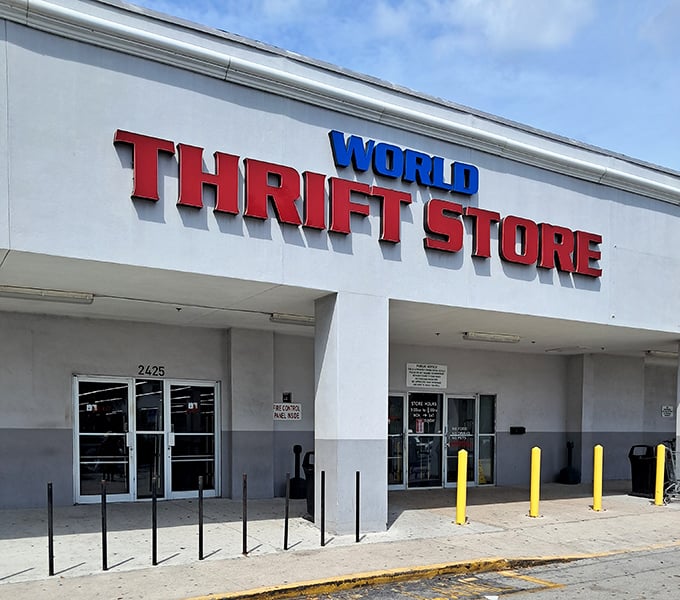 Morning light catches the bold lettering of World Thrift, where savvy shoppers arrive early to claim the day's best discoveries.