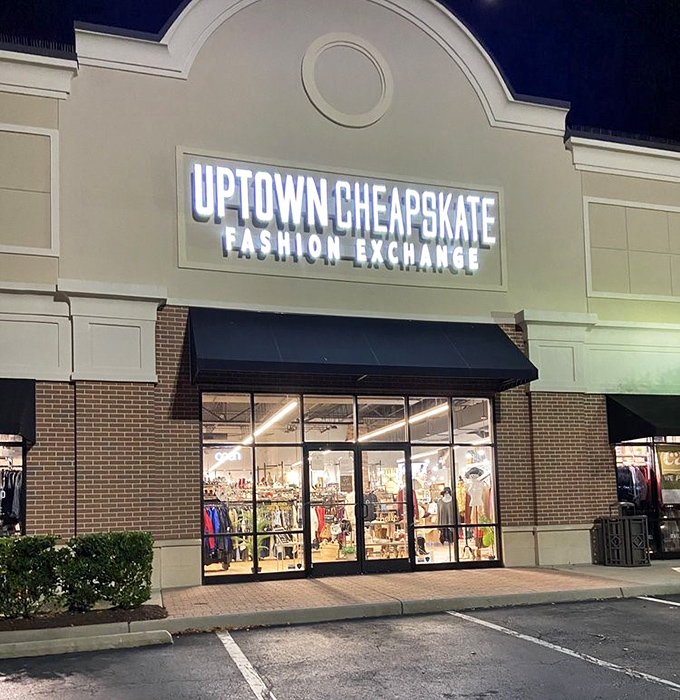 By night, the illuminated sign transforms into a beacon for bargain hunters. Like moths to a fashionable flame, savvy shoppers are drawn to its glow.