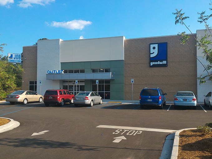 That distinctive Goodwill smile greets you from the parking lot, practically winking at your wallet with promises of incredible deals inside.