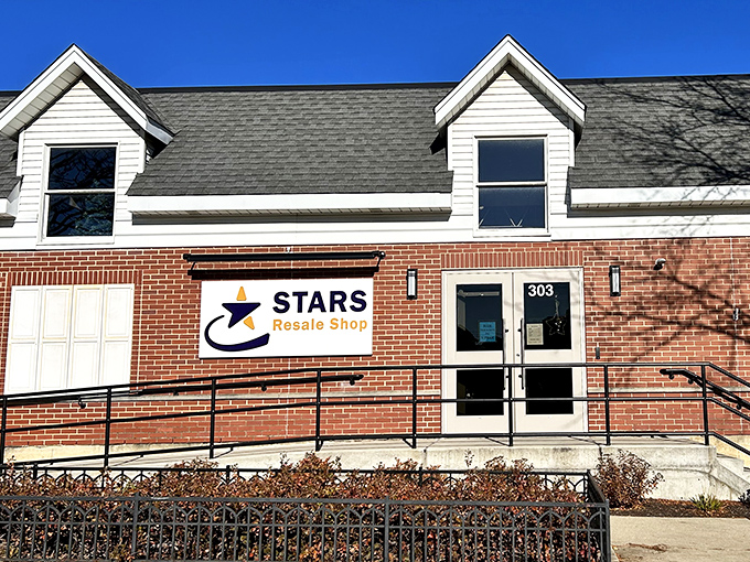 Blue skies frame this thrifter's paradise, where the "OPEN" flag might as well read "Adventure Awaits" for bargain hunters and collectors alike.