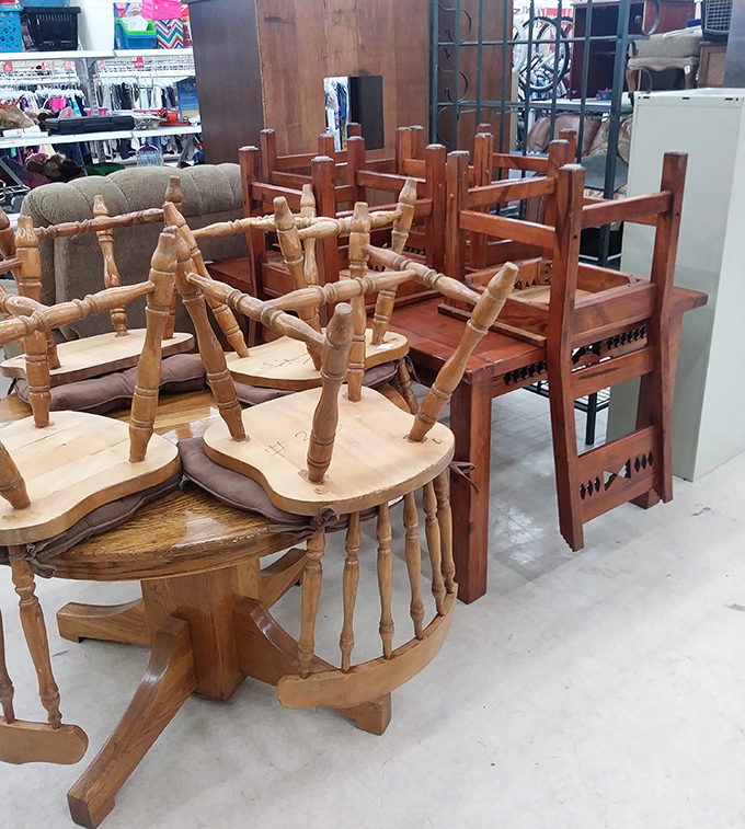 Wooden chairs stacked like a game of Jenga – each with stories to tell and dinner parties yet to host.
