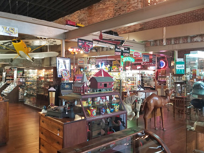 The shop's interior feels like stepping into a collector's dream, with vintage signs illuminating treasures from floor to ceiling.