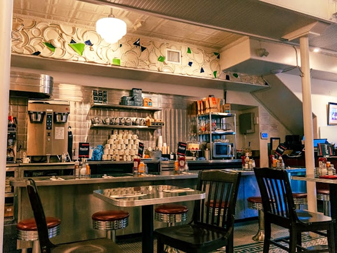 Classic diner aesthetics meet Southwestern charm at the counter, where spinning stools await the next hungry traveler's breakfast epiphany.