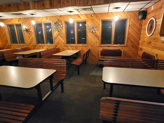 Wood-paneled walls and classic booth seating create that unmistakable supper club ambiance&mdash;like stepping into a time machine set to "peak comfort."